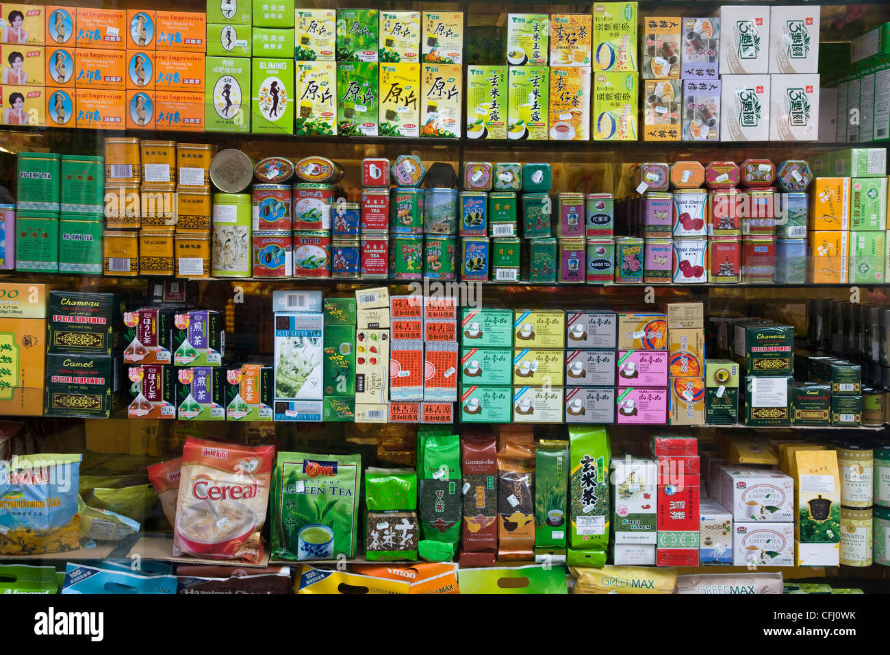 Shop window in Chinatown, London, with a range of Chinese teas, herbs ...