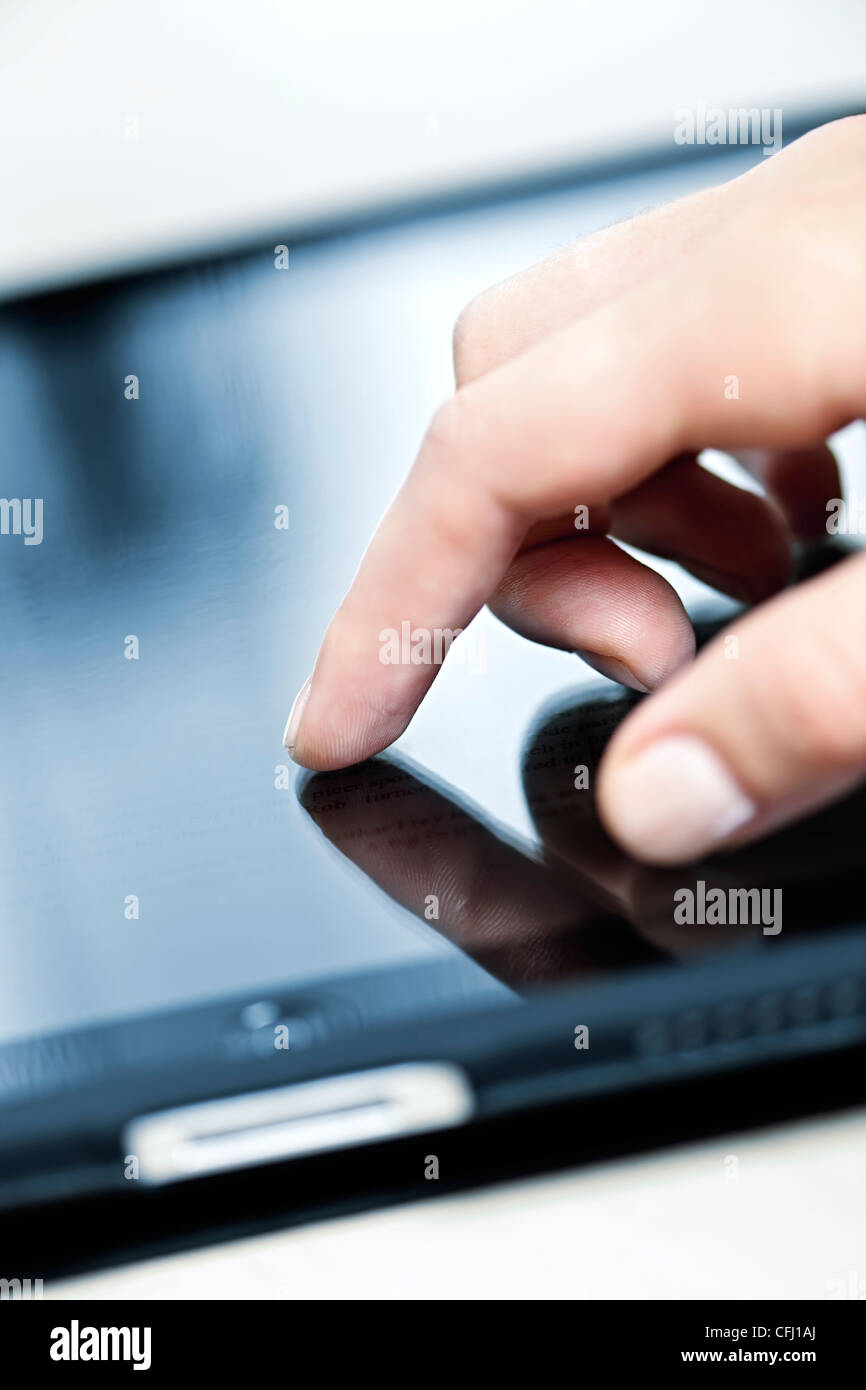 Female hand touching tablet computer screen with finger Stock Photo - Alamy