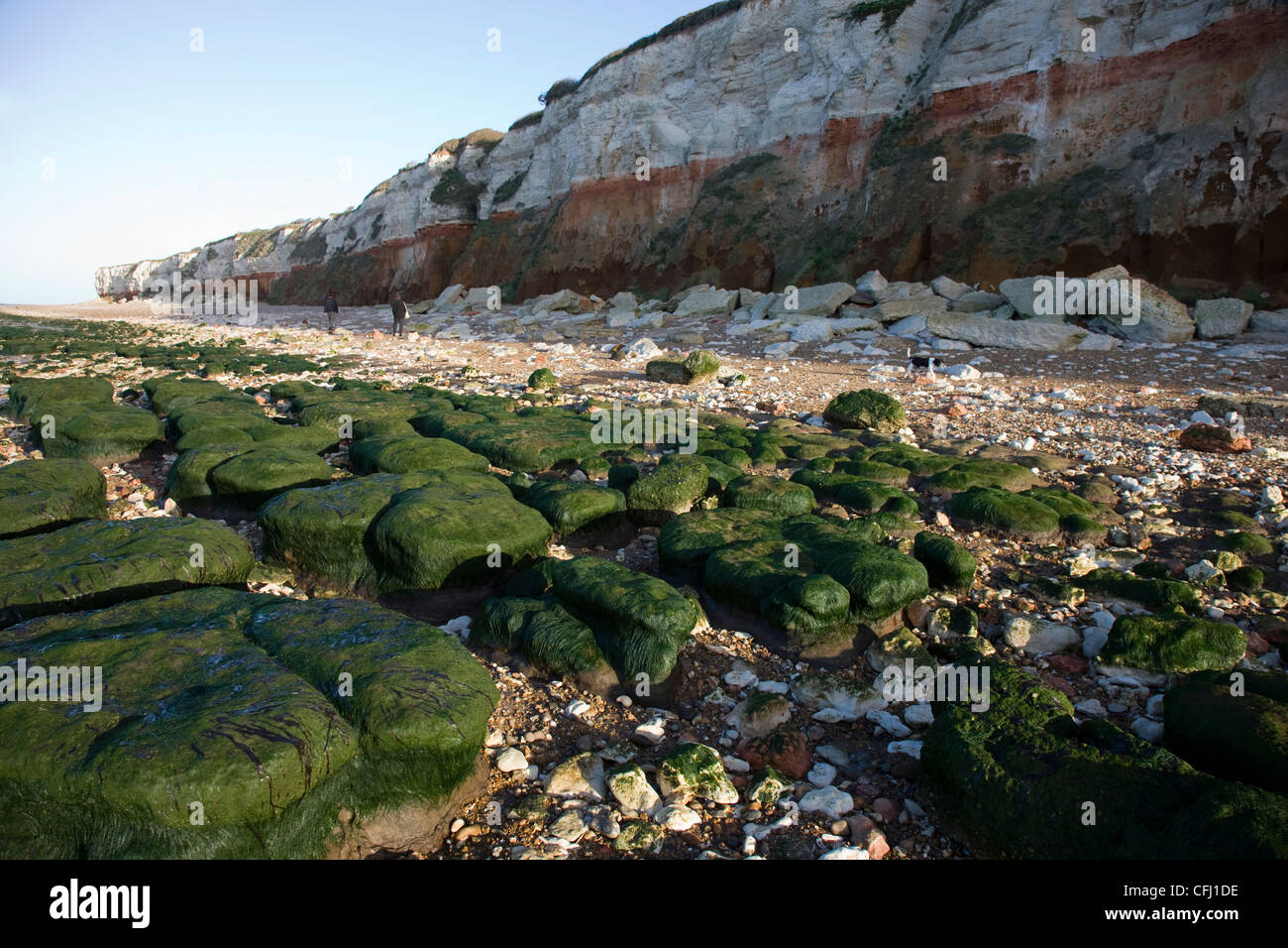 Cliffs made of red and white layered sedimentary rock with horizontal ...