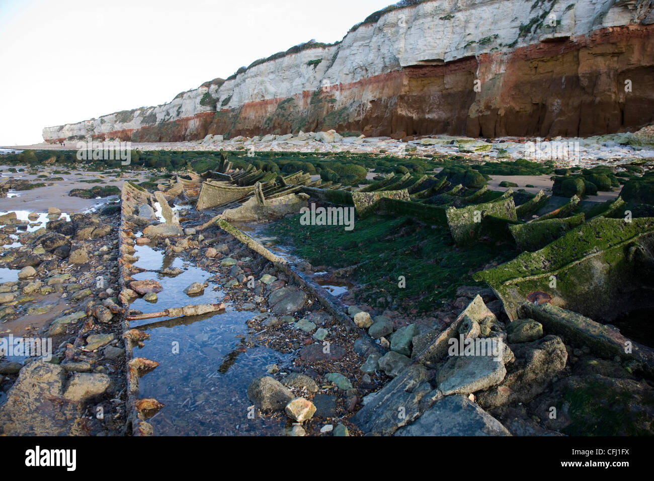 Cliffs made of red and white layered sedimentary rock with horizontal ...