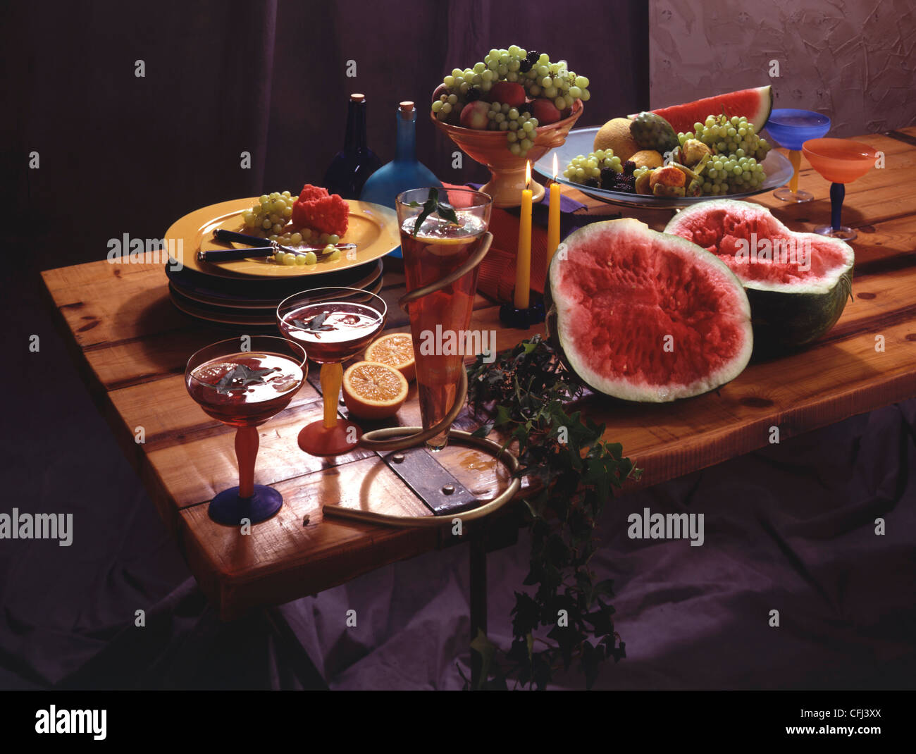 Fruit still life on wooden table Stock Photo - Alamy