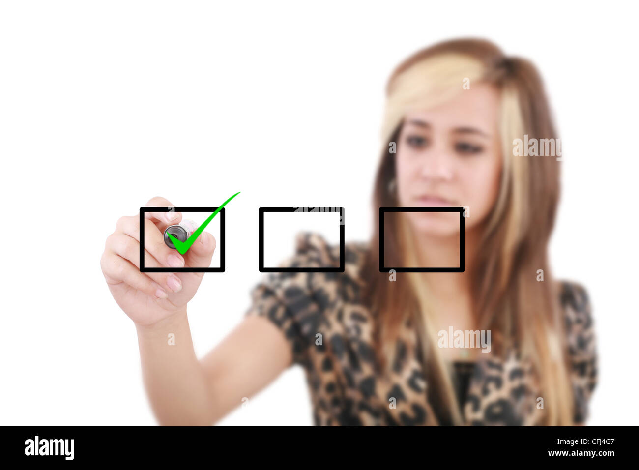 Young woman business hand with pen mark the check boxes. Hands on focus ...