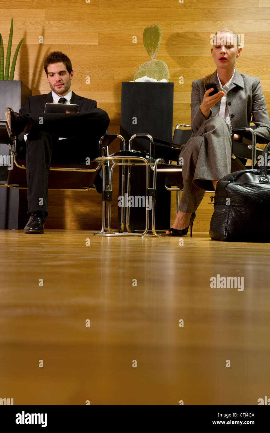 business woman waiting in office lobby Stock Photo - Alamy