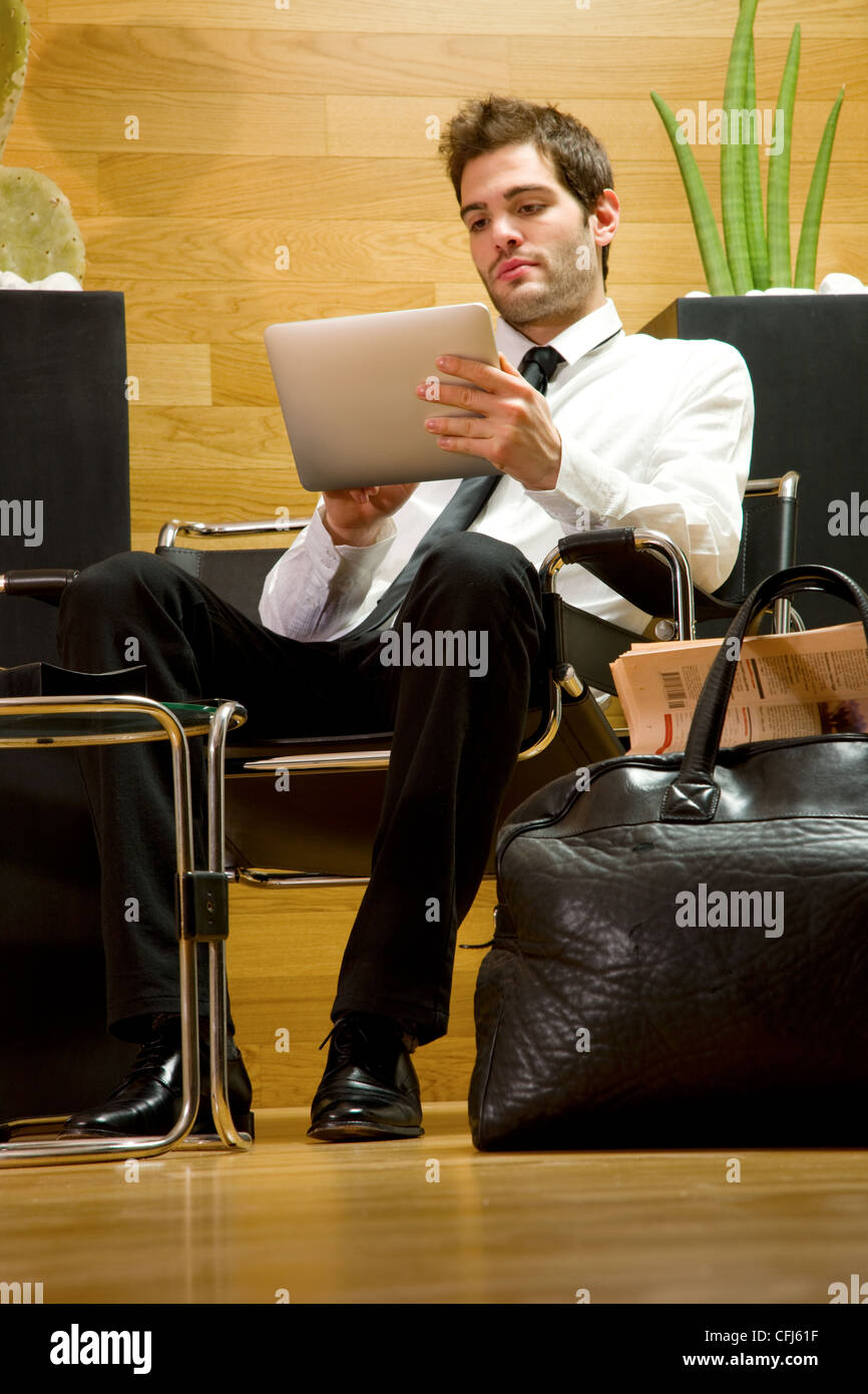 business woman waiting in office lobby Stock Photo - Alamy