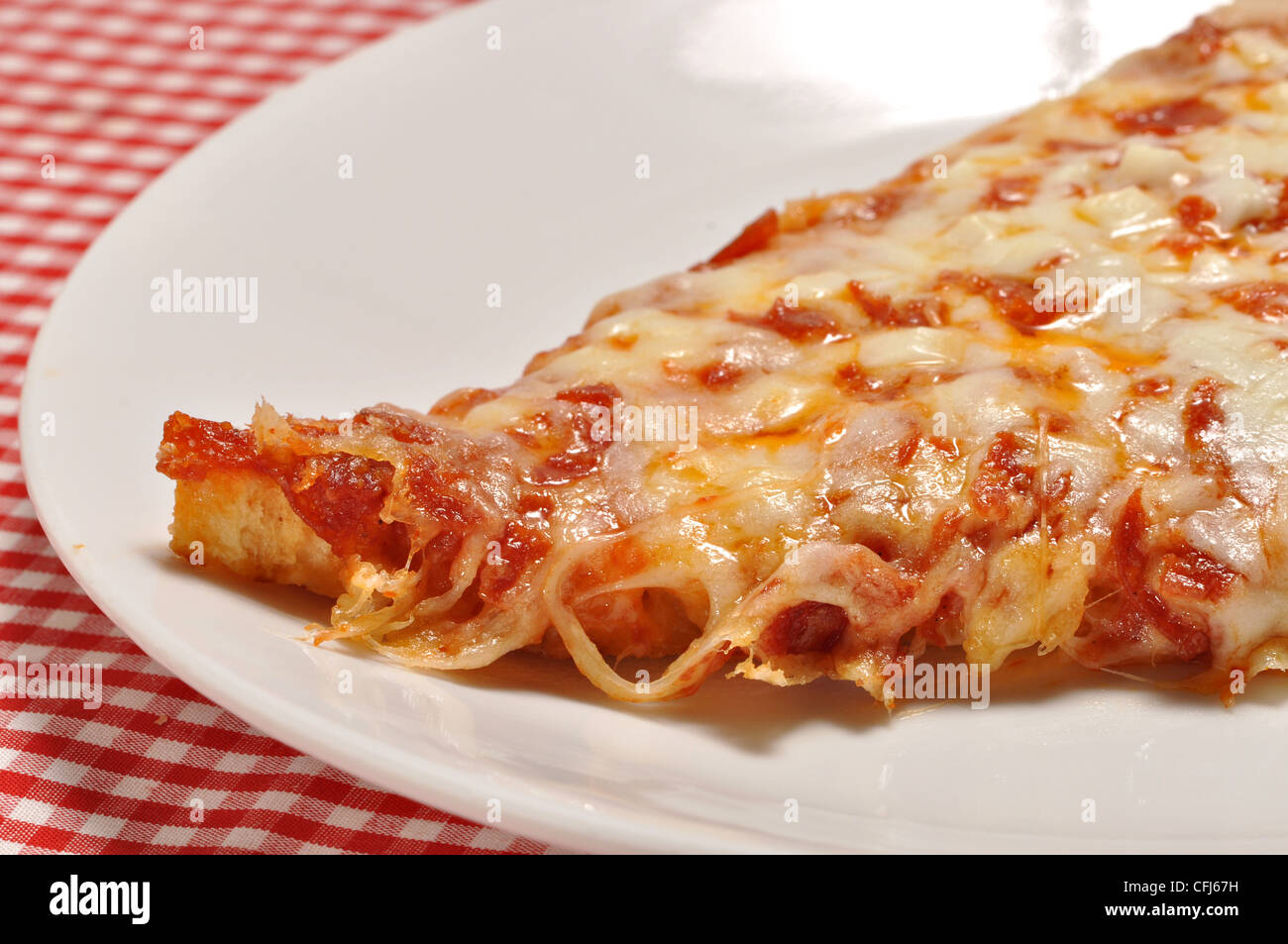 A closeup view of a slice of pizza Stock Photo - Alamy