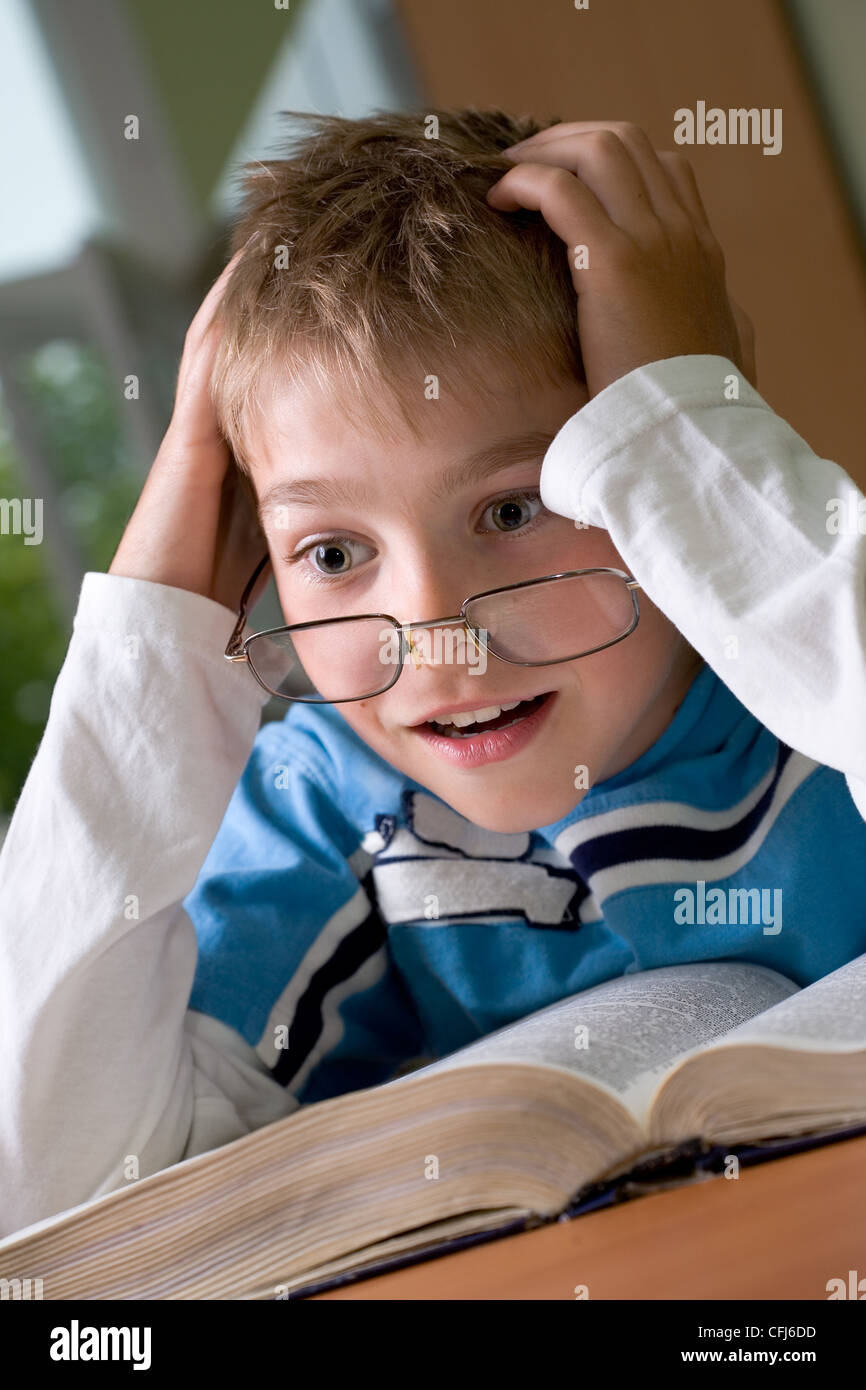 boy reading a book Stock Photo - Alamy