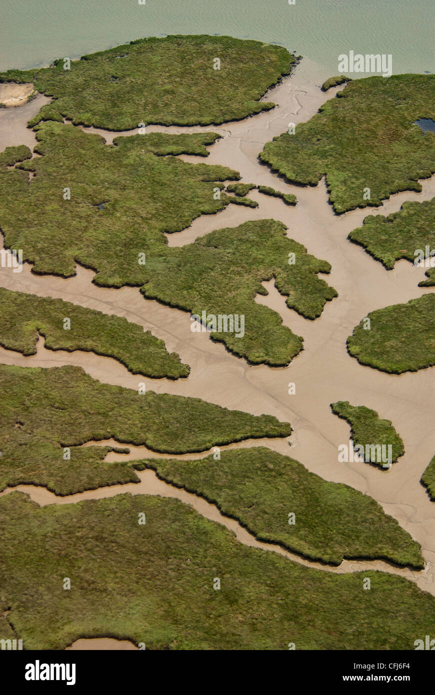 Aerial view of river leading in to larger river in Suffolk, East Anglia ...