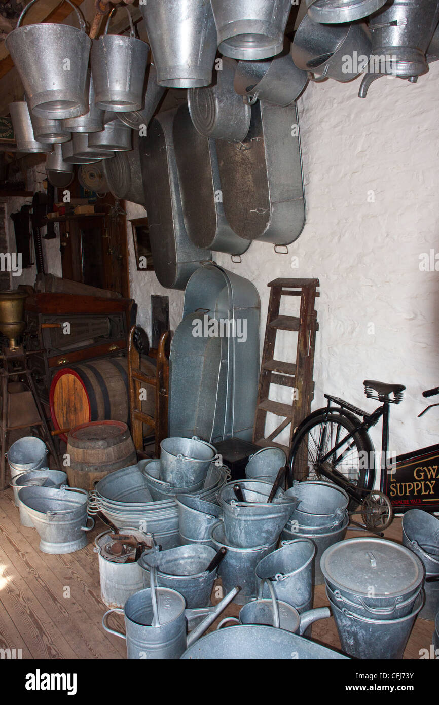 old grocery delivery bike in hardware shop with old fashioned tin ware ...