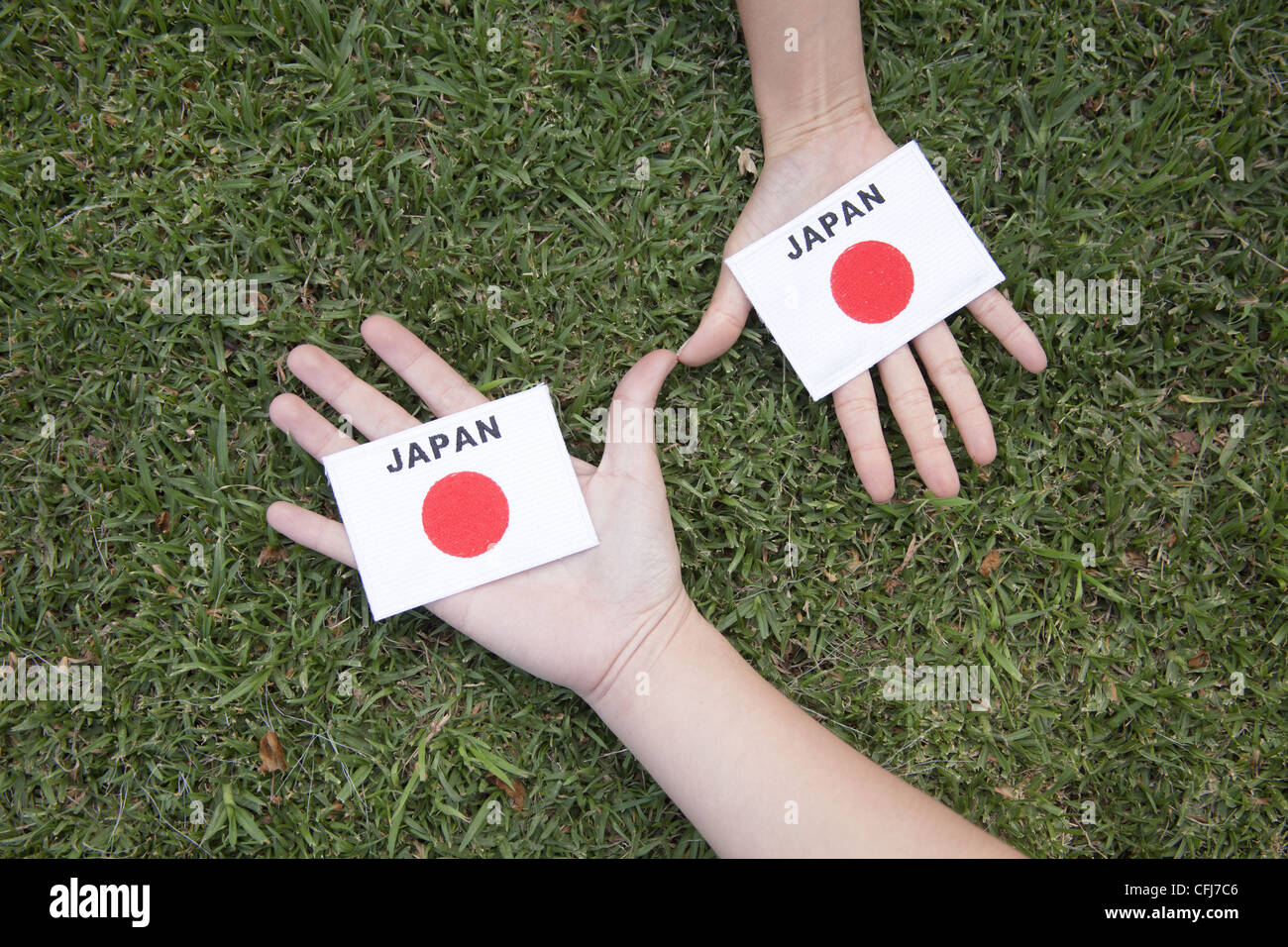Hands Holding Japanese Flags High Resolution Stock Photography and ...