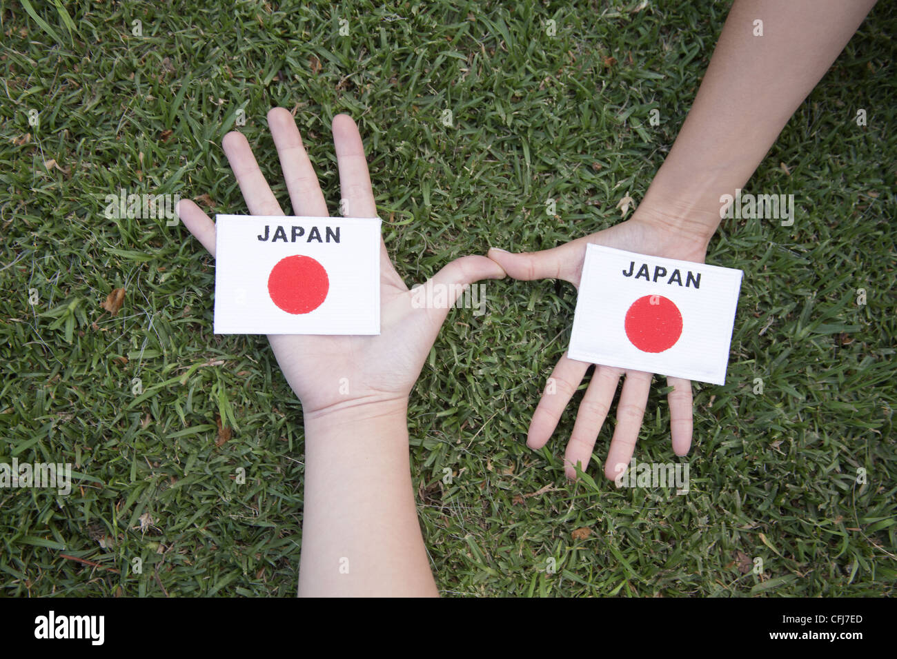 Hands holding japanese flags hi-res stock photography and images - Alamy