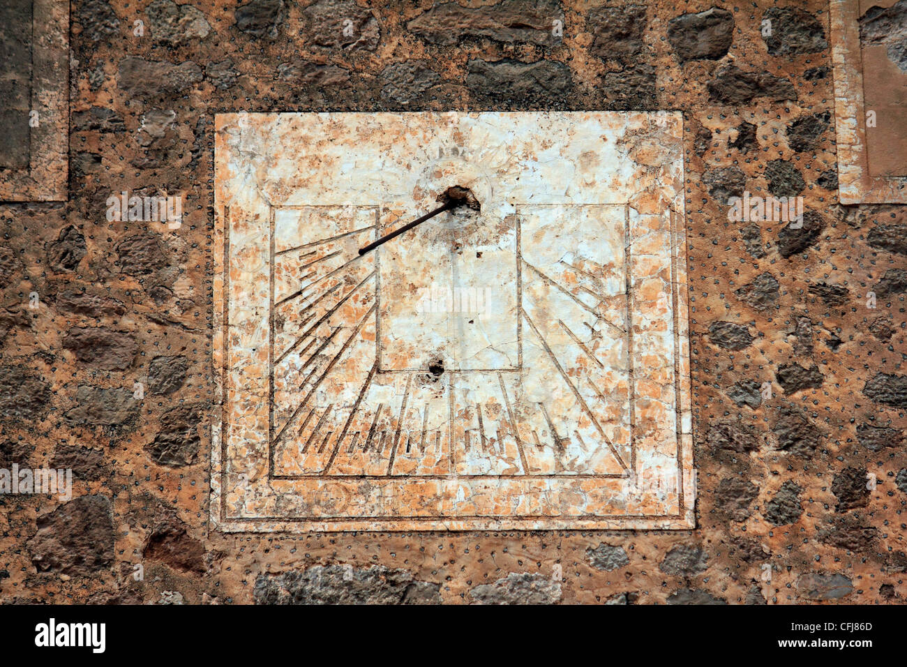 Ancient sundial on an old cobbled wall Stock Photo - Alamy