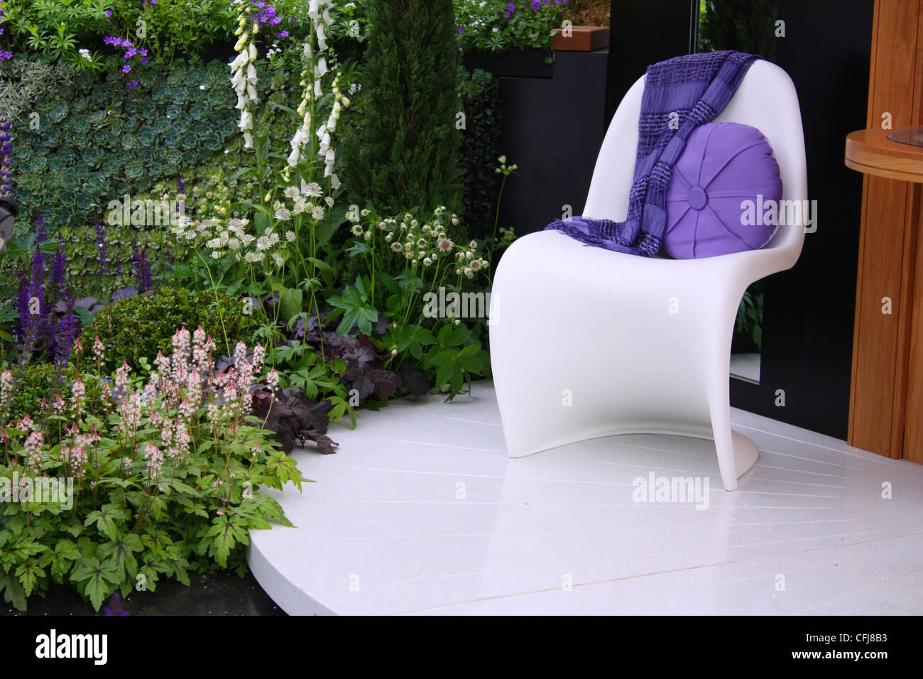 Chair and flowering plants hi-res stock photography and images - Alamy