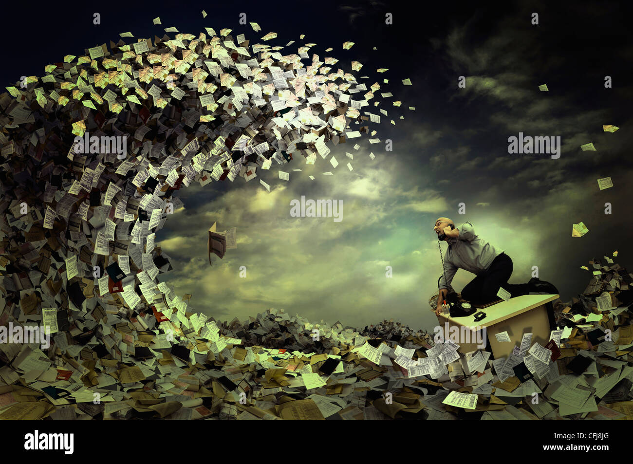 Castaway businessman in a sea of papers and files Stock Photo - Alamy