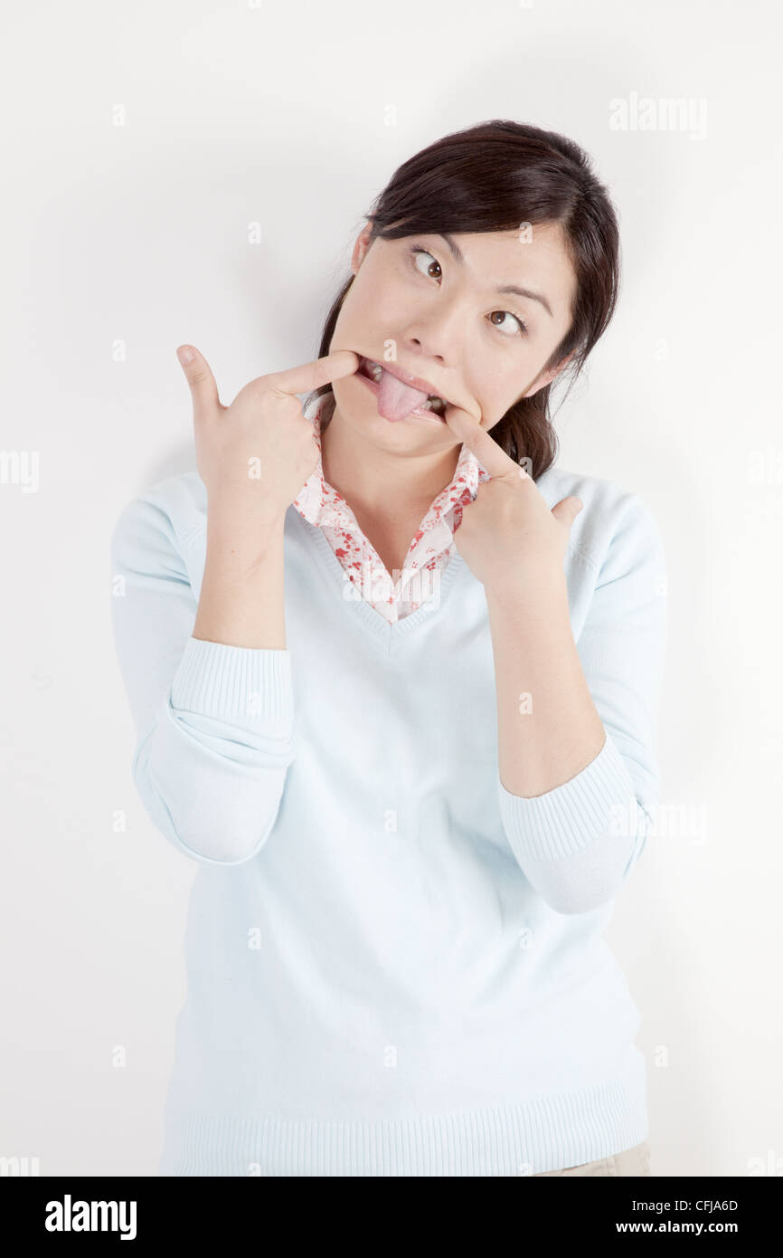 Young woman making funny face Stock Photo - Alamy