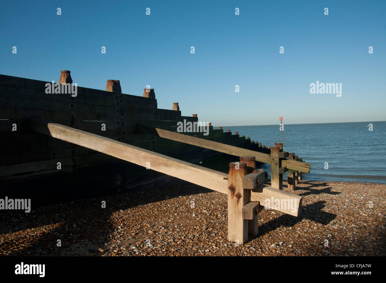 Breakwater on beach kent, coastal sea defences Stock Photo - Alamy