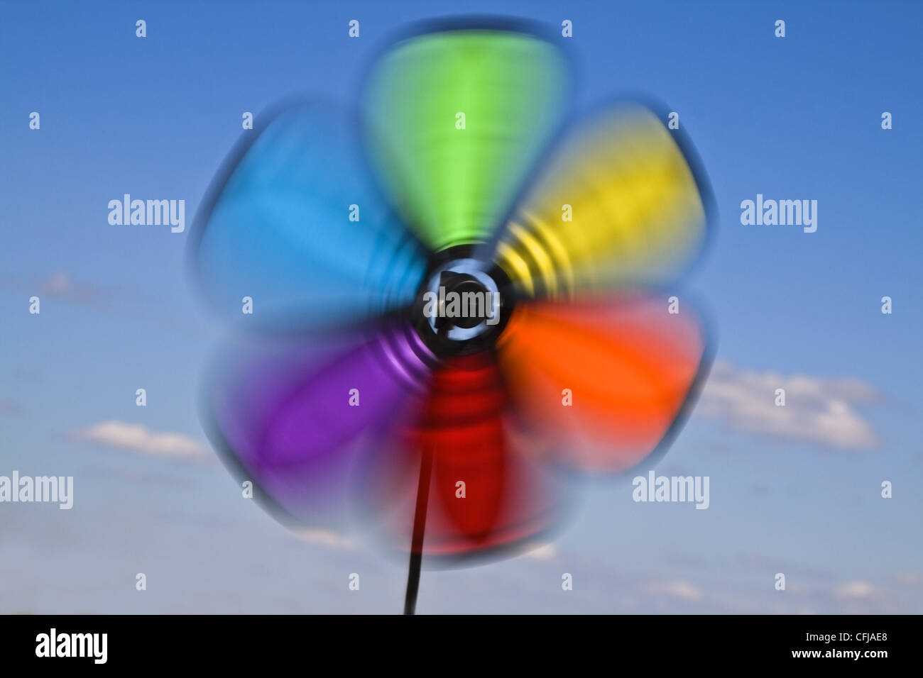 Colorful image of a vane in motion against a cloudy sky Stock Photo - Alamy