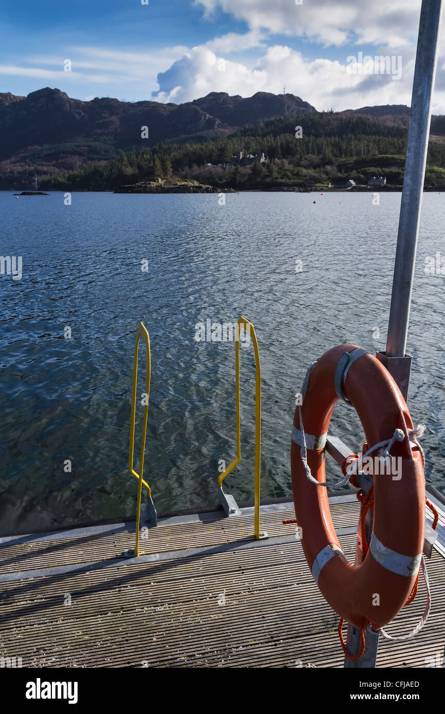 Bathing pontoon with metal ladder and lifebouy Plockton Bay Loch Carron ...