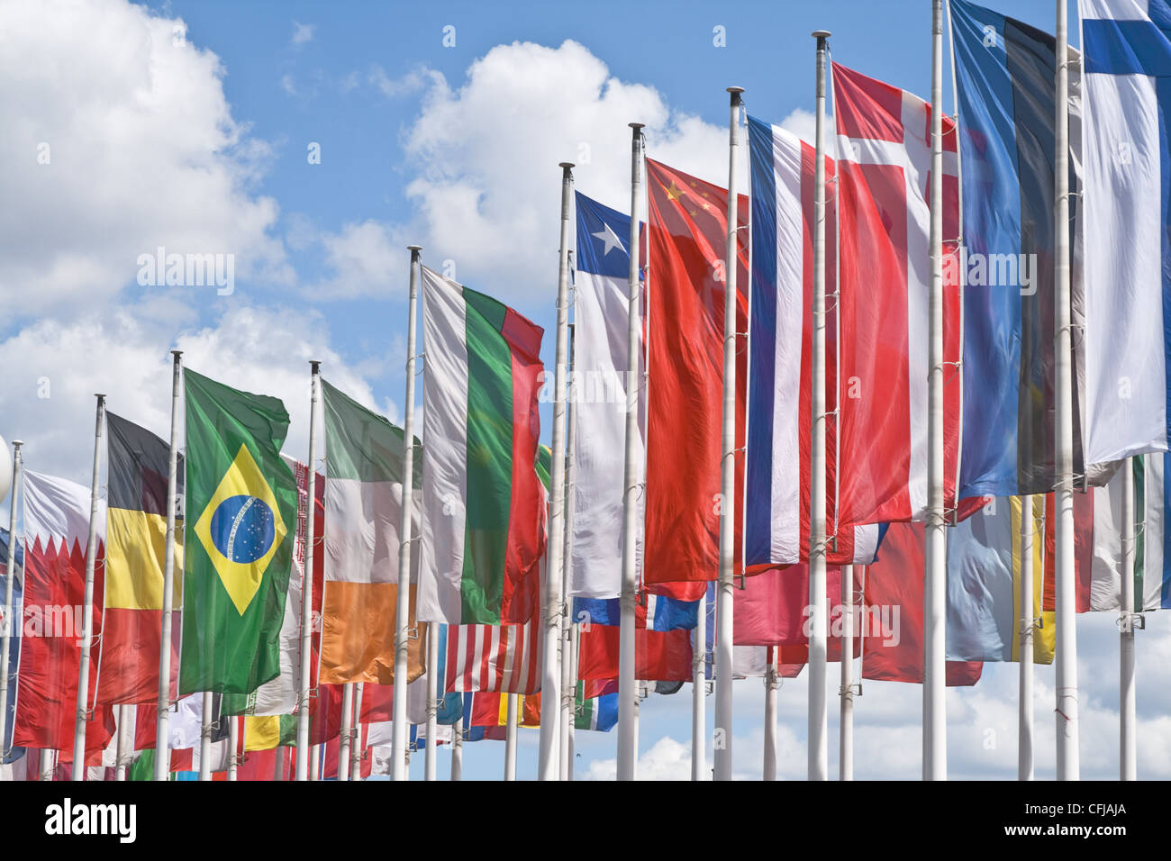 Many national flags against a beautiful cloudy sky Stock Photo - Alamy