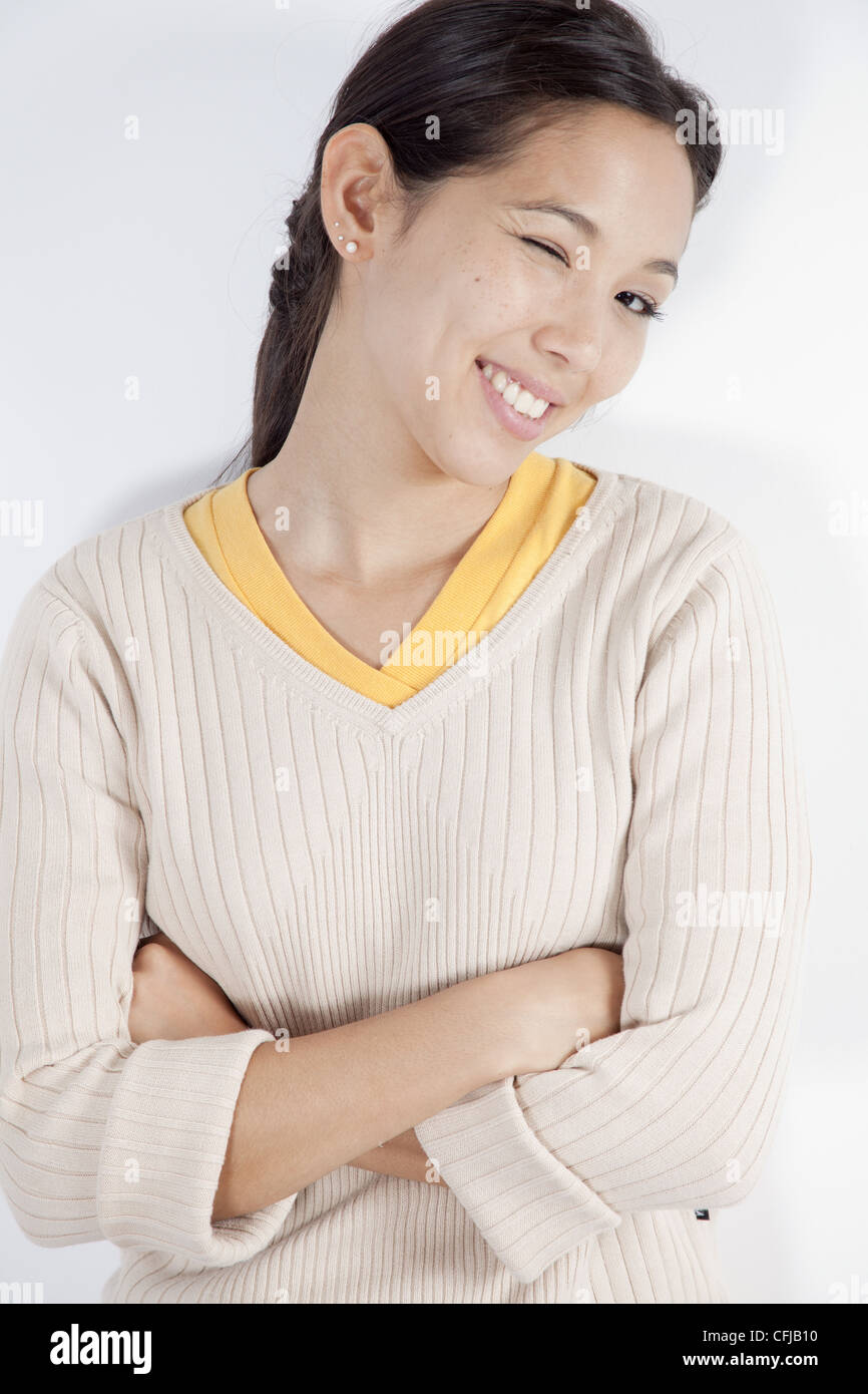 Young woman winking Stock Photo - Alamy