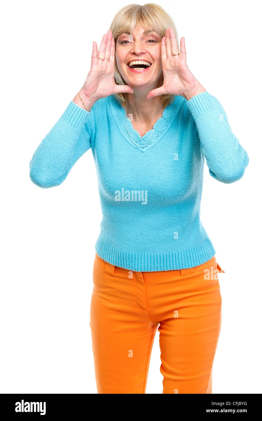 Happy senior woman shouting through megaphone shaped hands Stock Photo ...