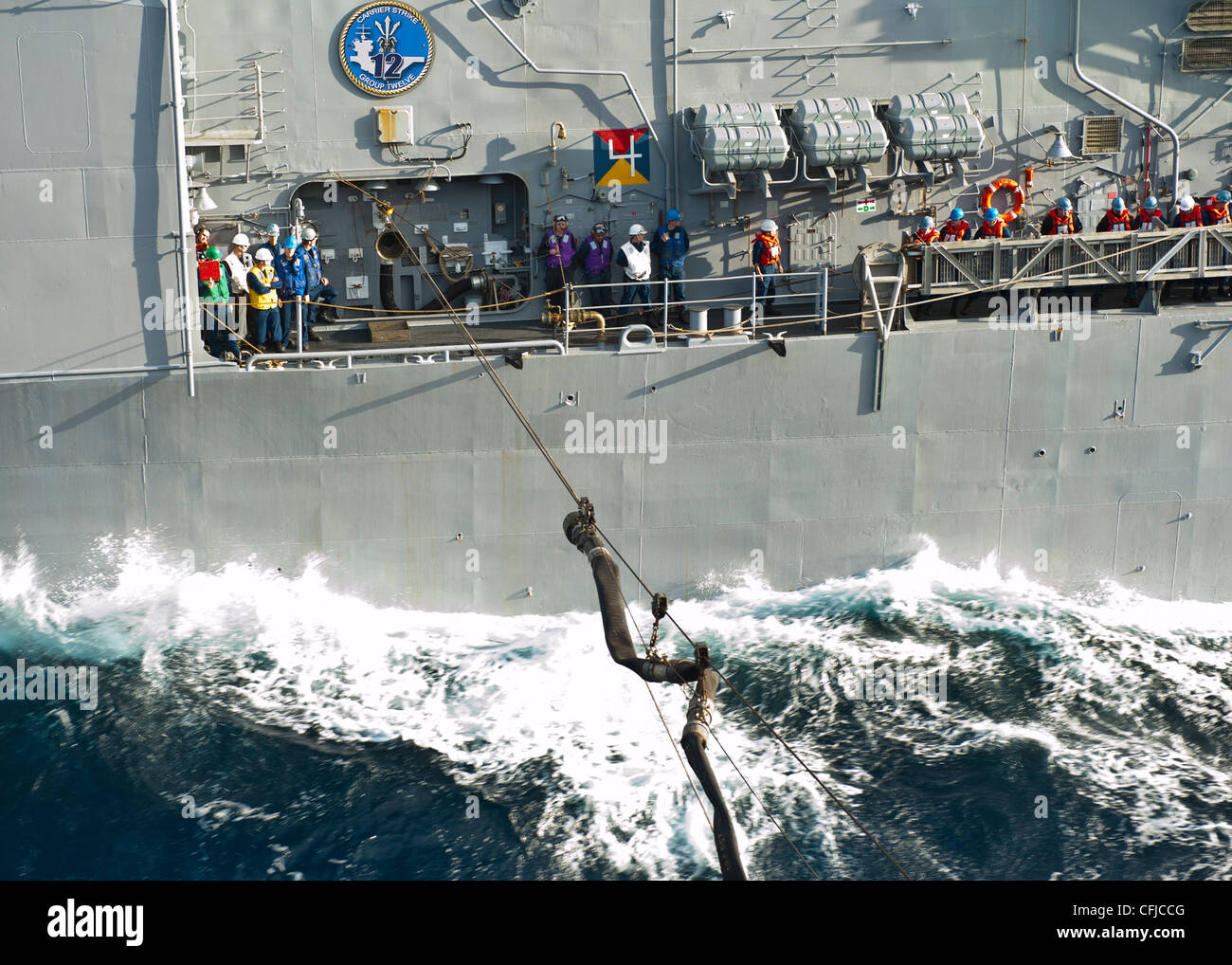 The guided-missile cruiser USS Vicksburg (CG 69) performs a ...