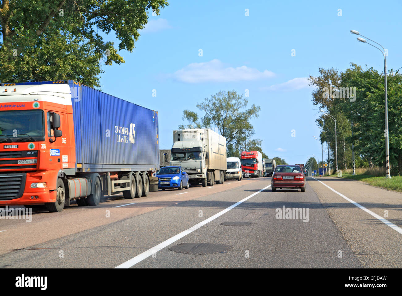 cargo cars on asphalt road Stock Photo - Alamy