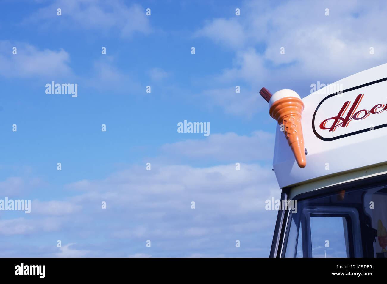 An ice cream van with a cone on the roof Stock Photo - Alamy