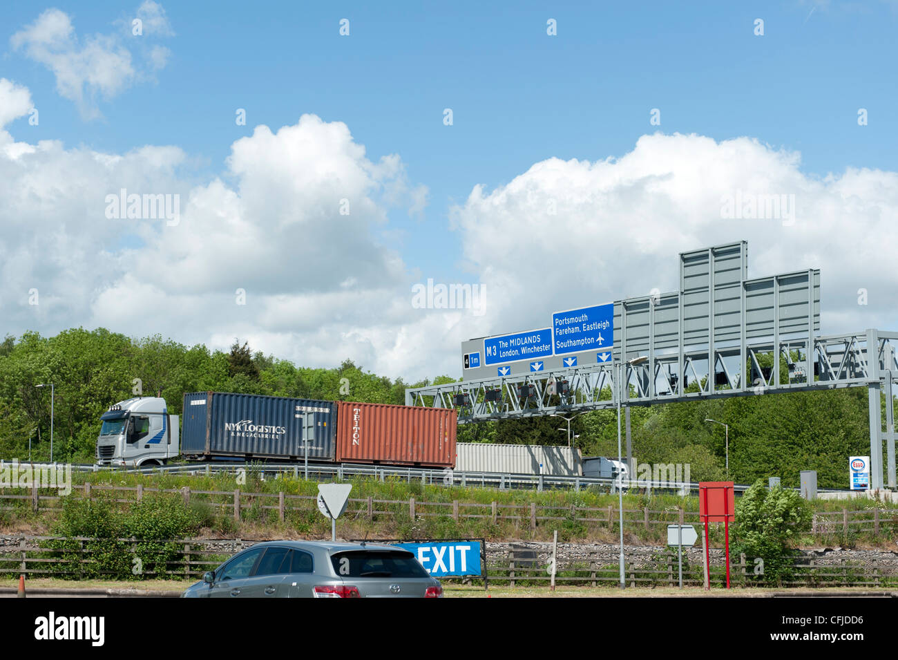 Road signs on an overhead gantry on the M27, Eastbound Stock Photo - Alamy