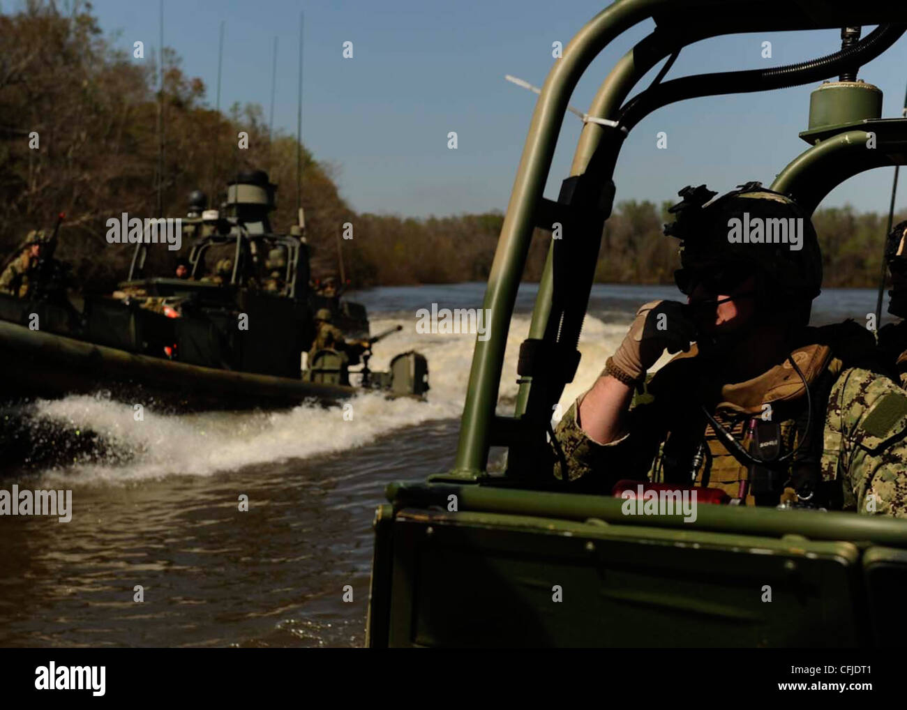 U.S. Navy members conduct boat patrols during Emerald Warrior ...