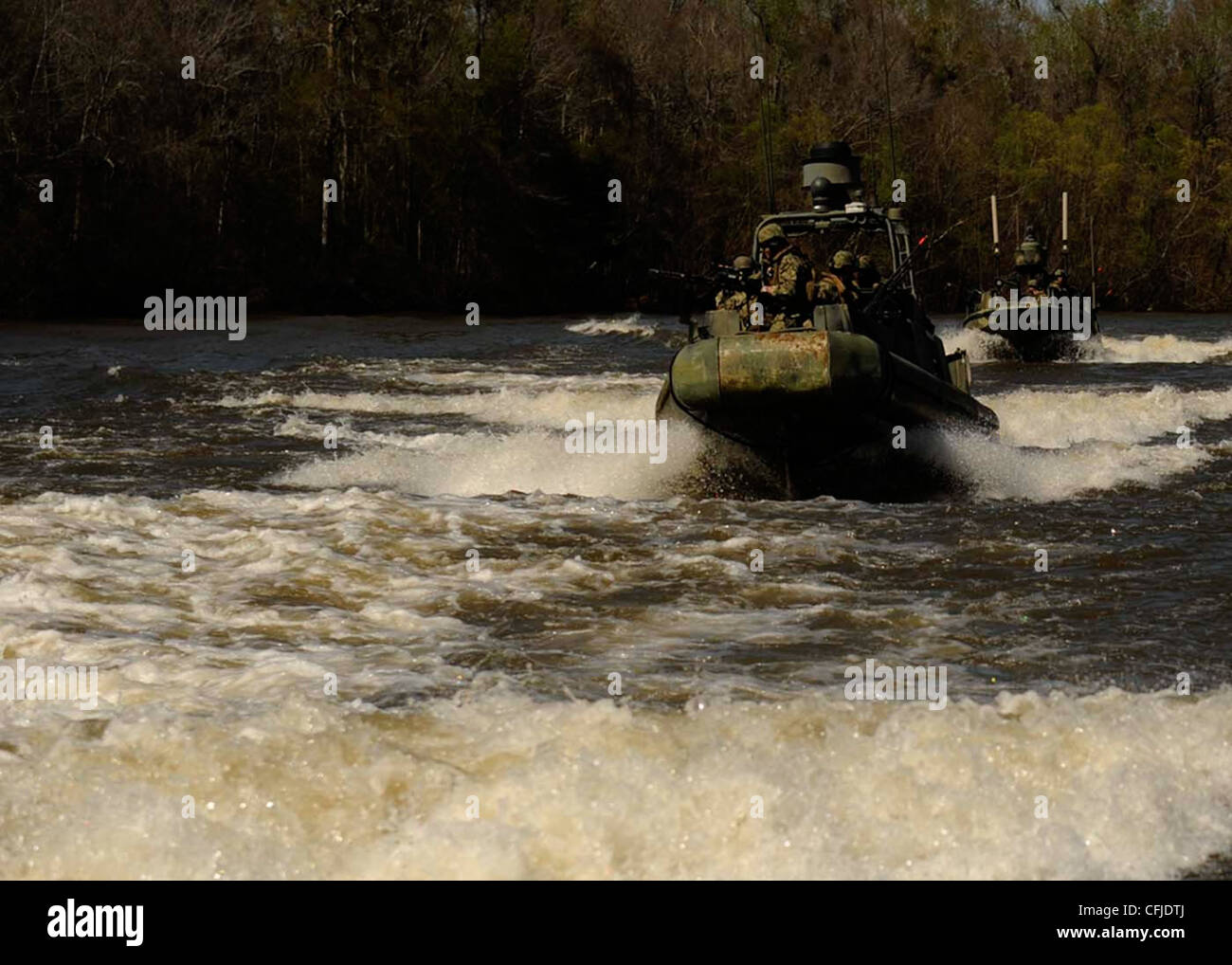 U.S. Navy members conduct boat patrols during Emerald Warrior ...