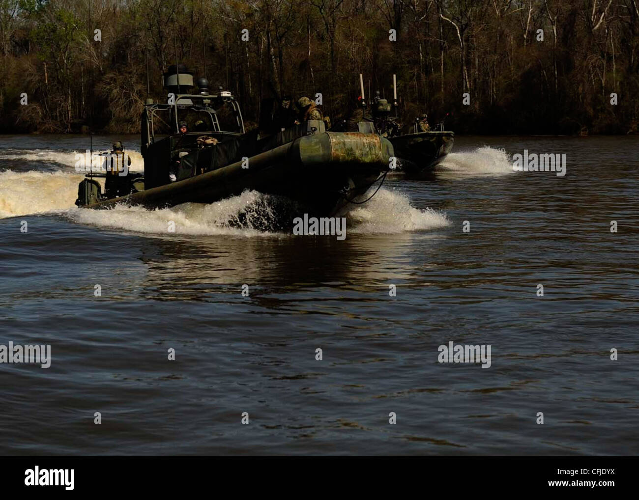 U.S. Navy members conduct boat patrols during Emerald Warrior ...