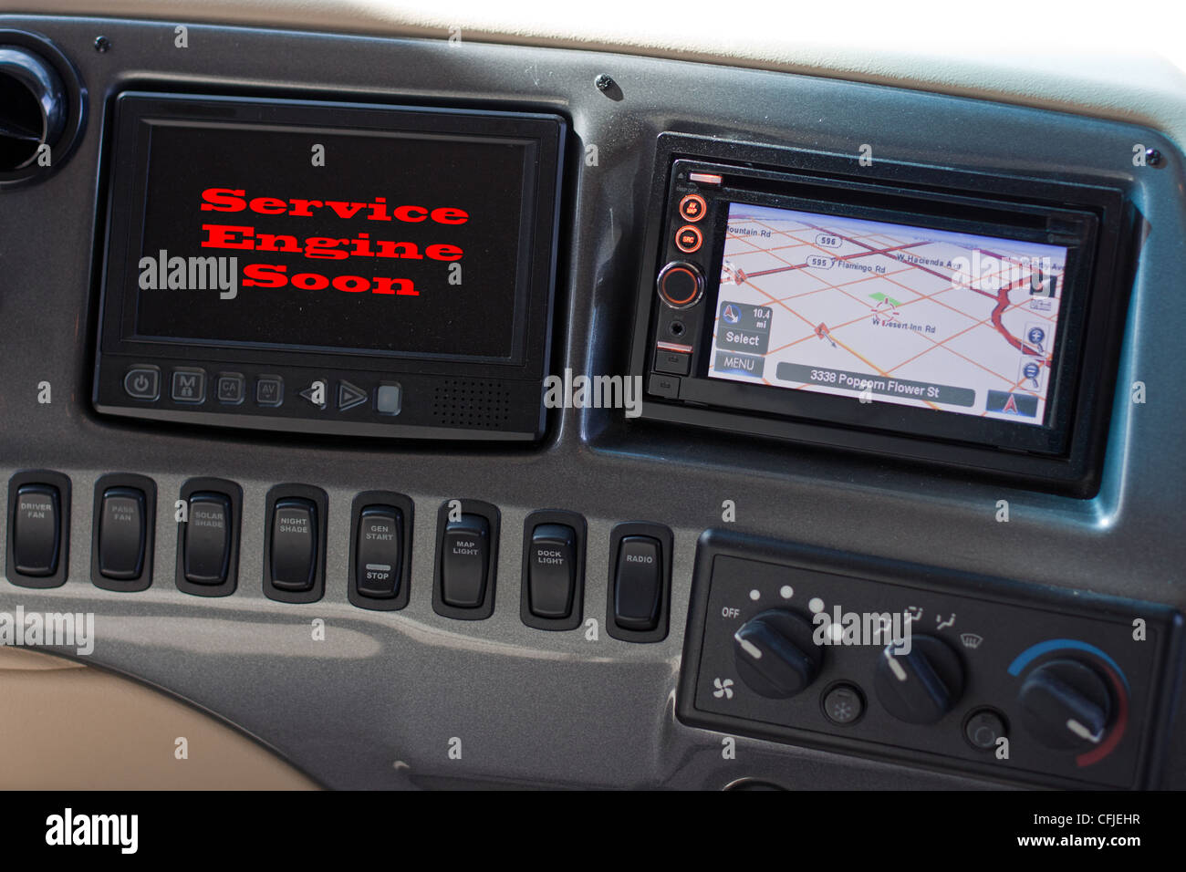 Motor home dashboard with service engine light and GPS Stock Photo - Alamy