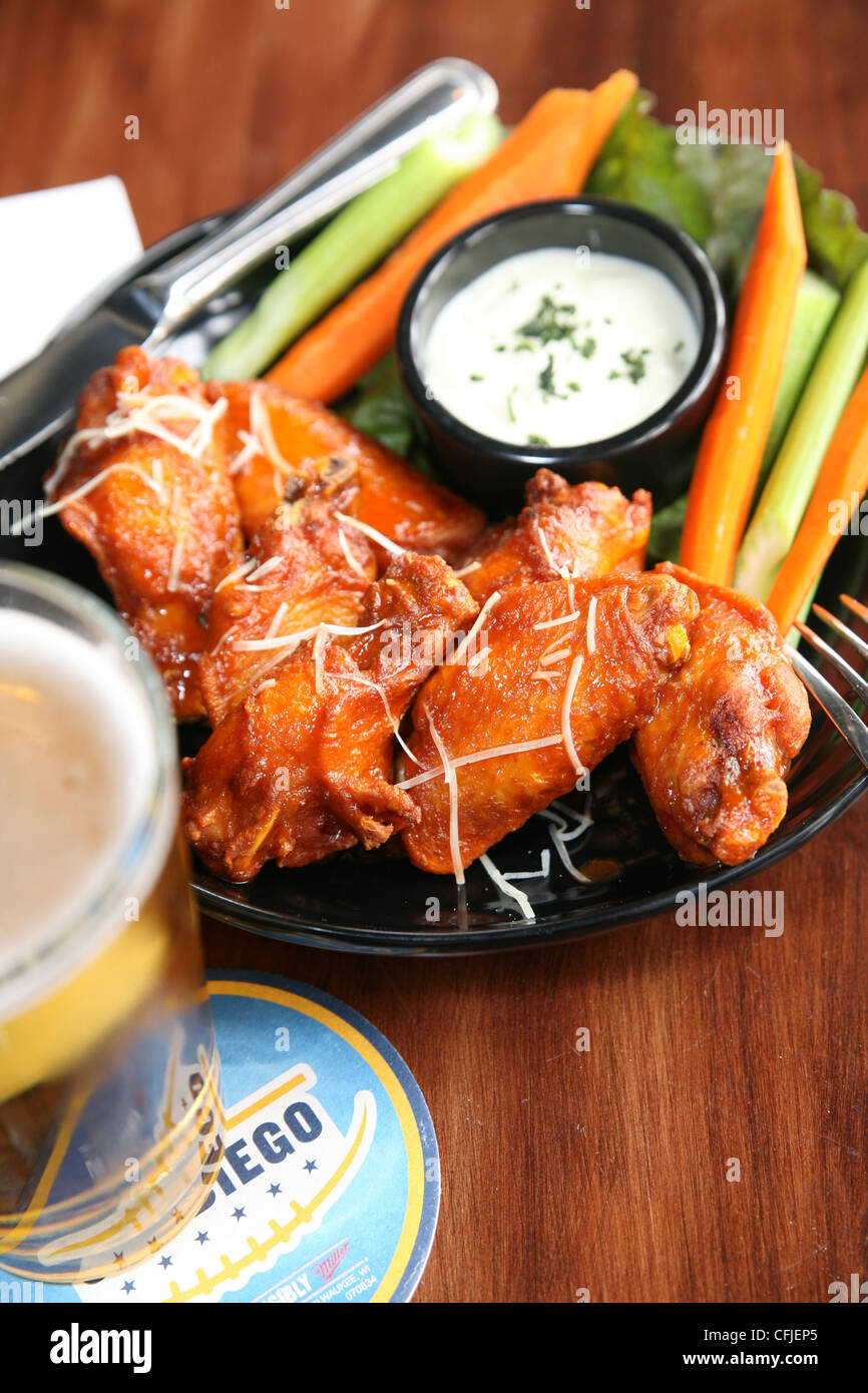 Spicy buffalo wings with bleu cheese dipping sauce Stock Photo - Alamy