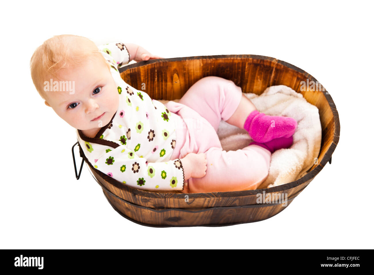 Infant sitting in wooden bucket Stock Photo - Alamy