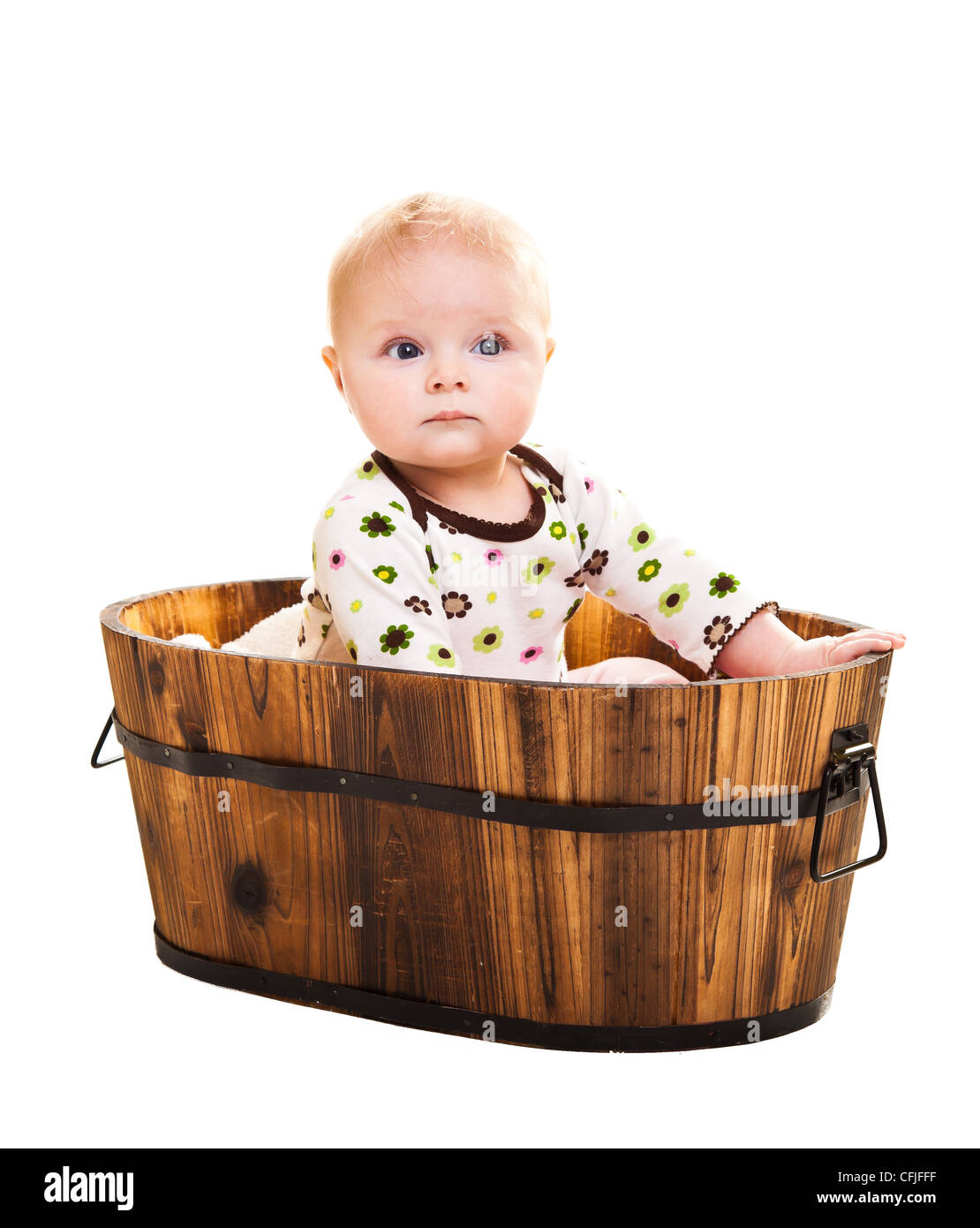 Infant sitting in wooden bucket Stock Photo - Alamy