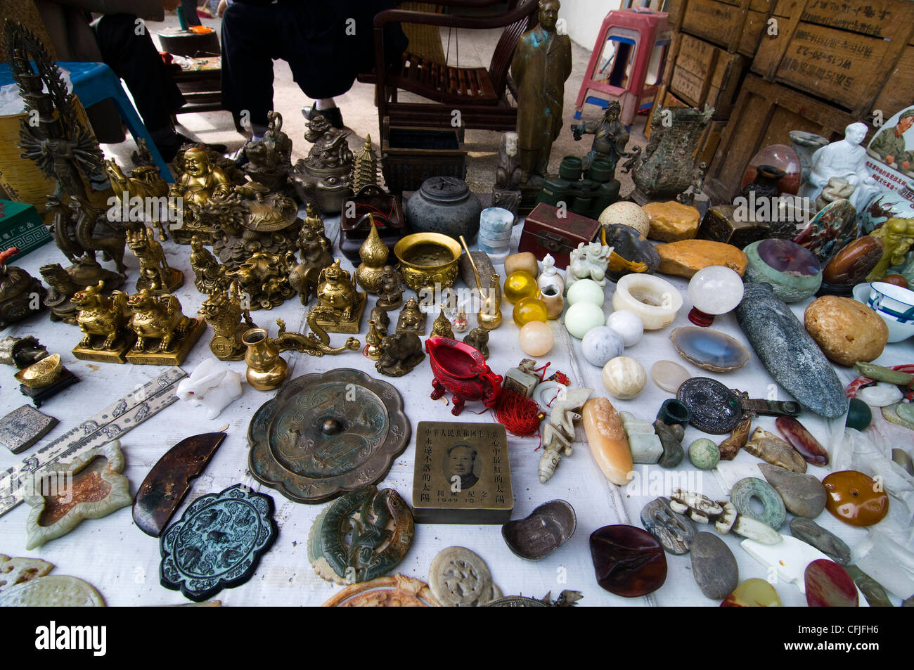 Traditional Chinese look alike antiques sold in a small street stall in ...