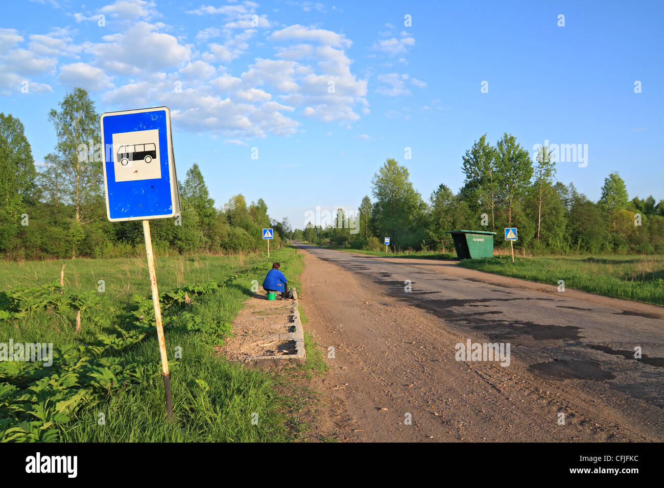 bus stop on rural road Stock Photo - Alamy