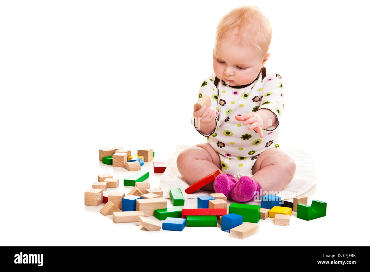 Infant girl playing with bricks on white isolated background Stock ...
