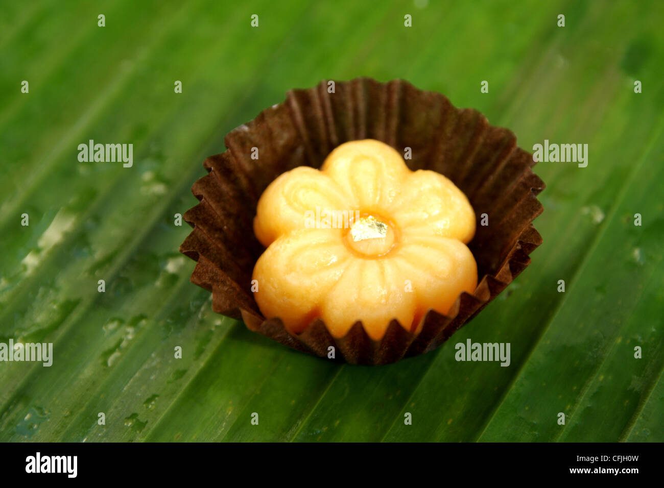 Egg yolks dumpling topped with an edible gold leaf hi-res stock ...