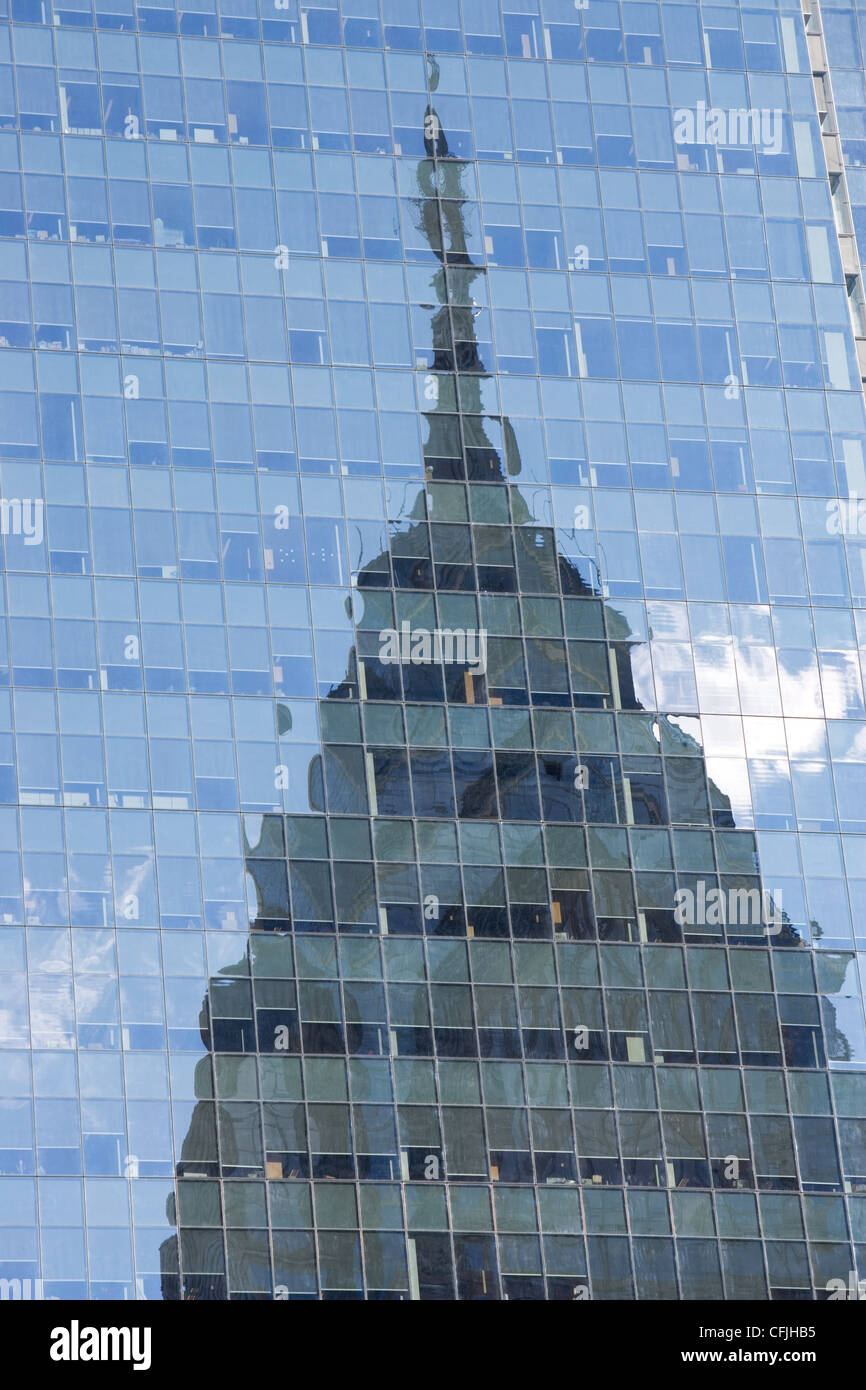 Building reflected in glass of skyscraper Stock Photo - Alamy