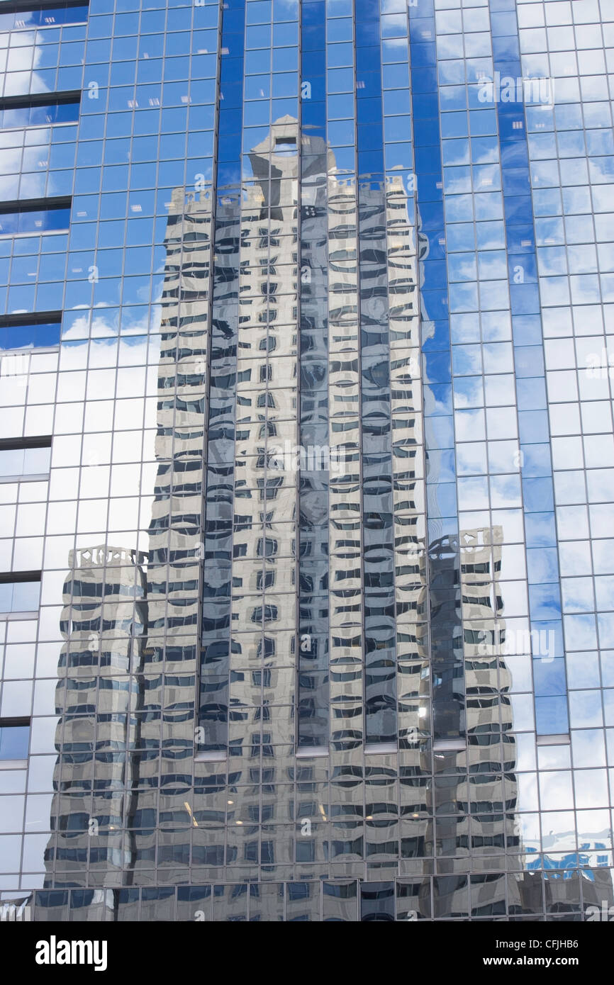 Building reflected in glass of skyscraper Stock Photo - Alamy