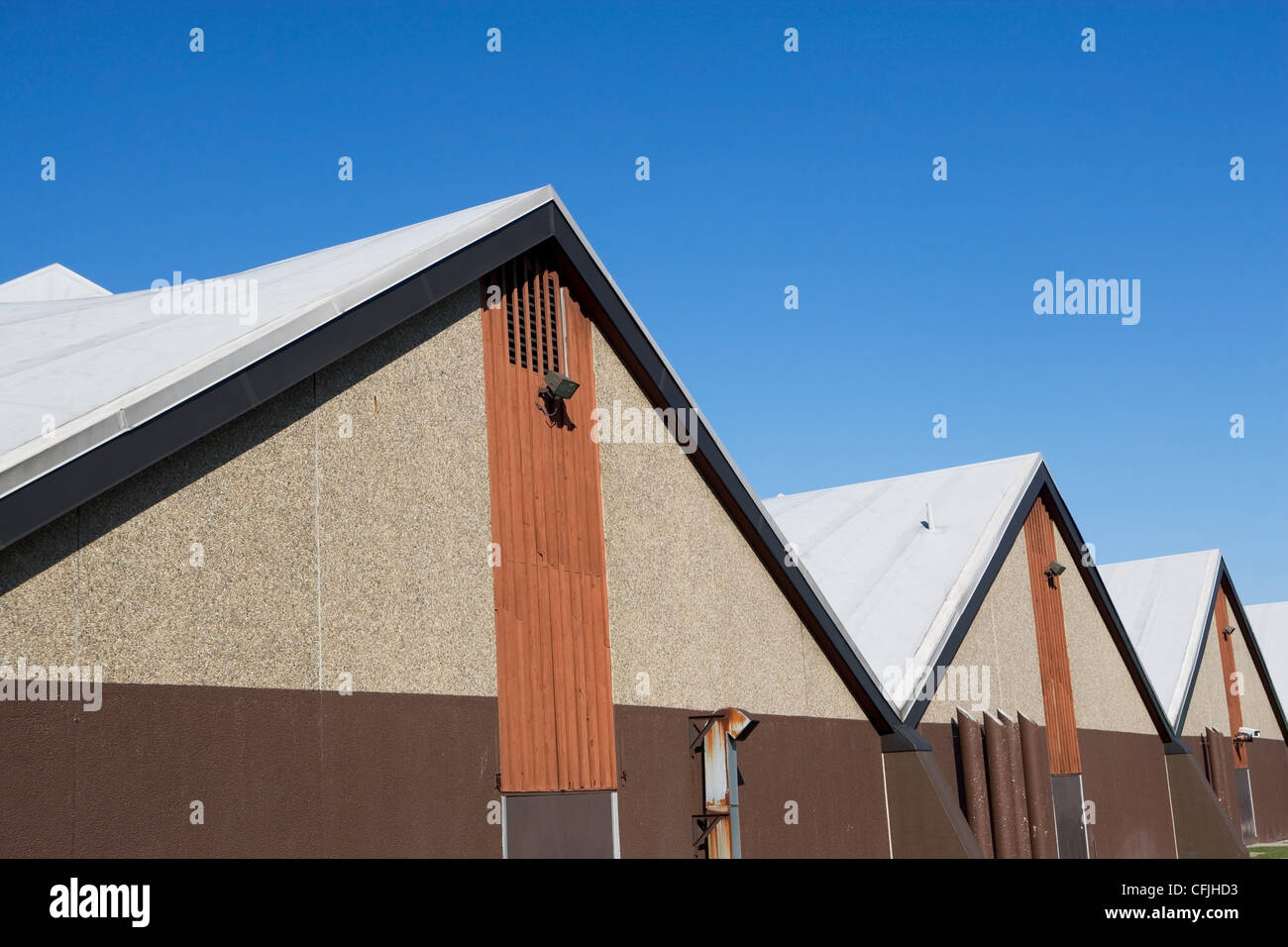Row of industrial buildings Stock Photo - Alamy