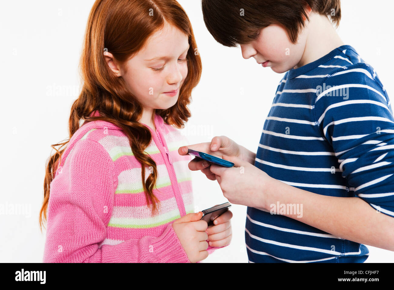 Children looking a smartphones Stock Photo - Alamy
