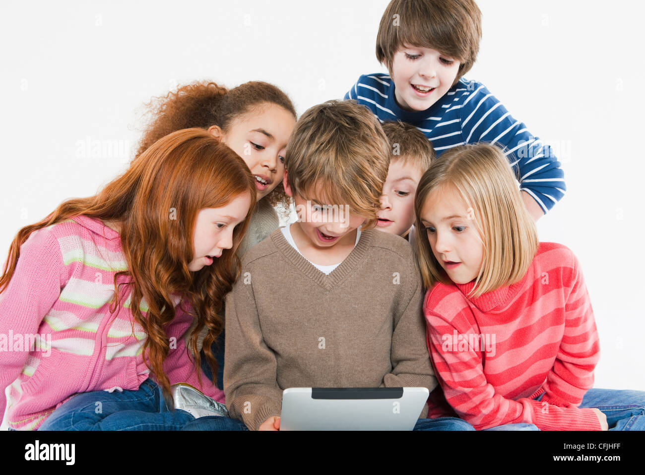 Children looking at digital tablet Stock Photo - Alamy