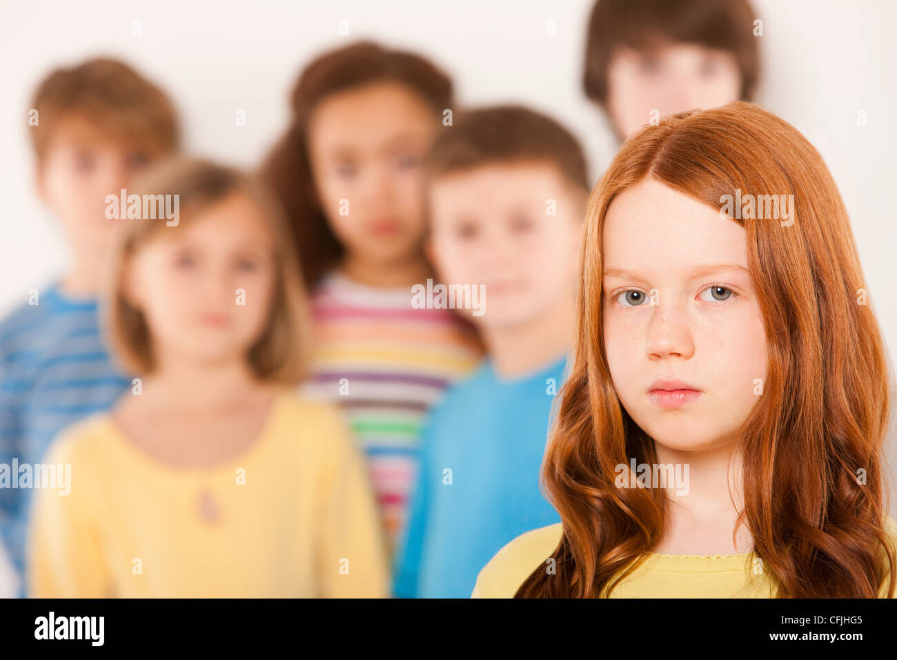 Girl separate from other children Stock Photo - Alamy