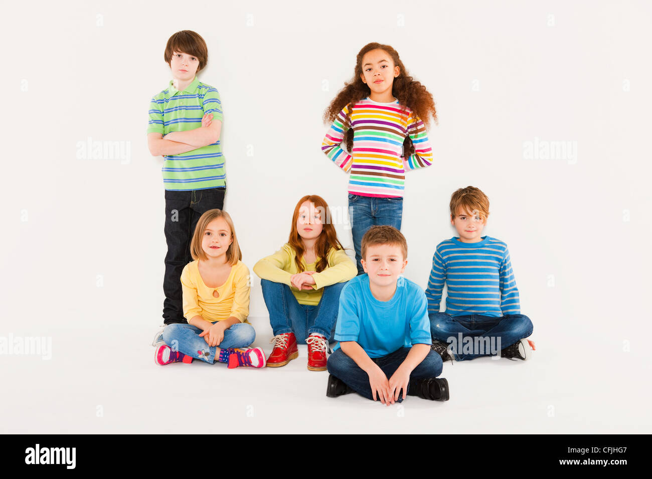 Children sitting and standing Stock Photo - Alamy