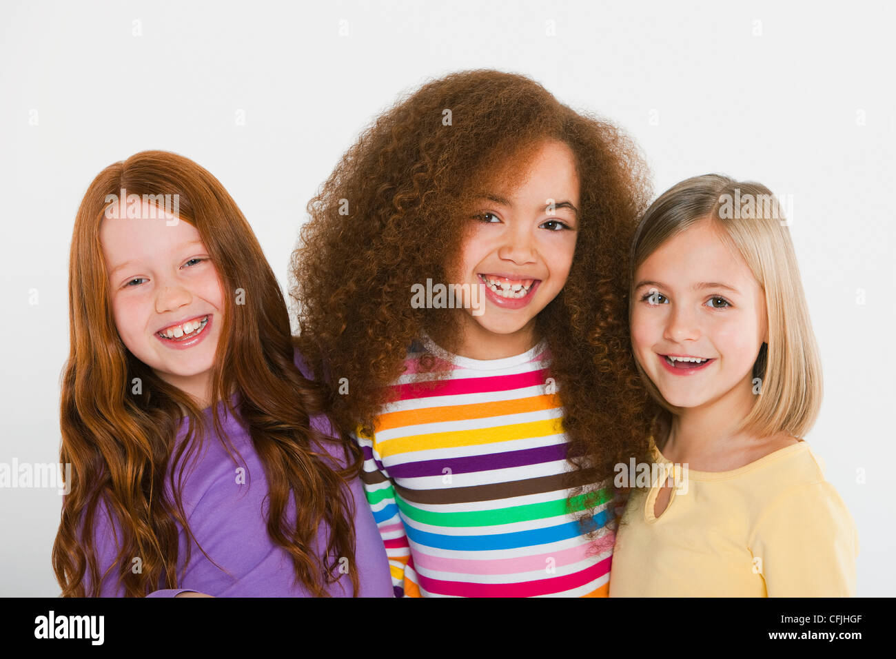 Three girls smiling Stock Photo - Alamy