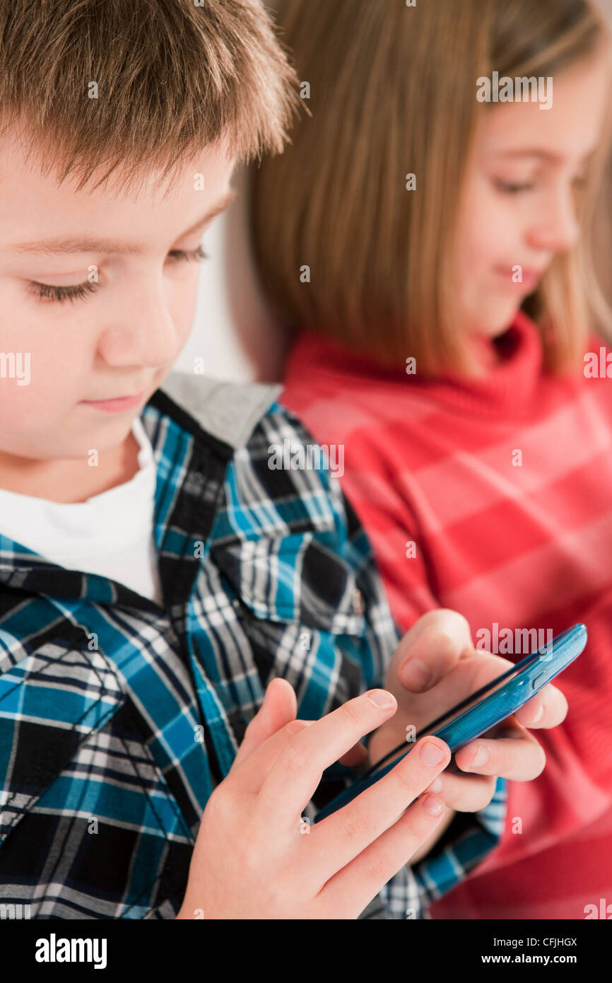 Children using smartphones Stock Photo - Alamy