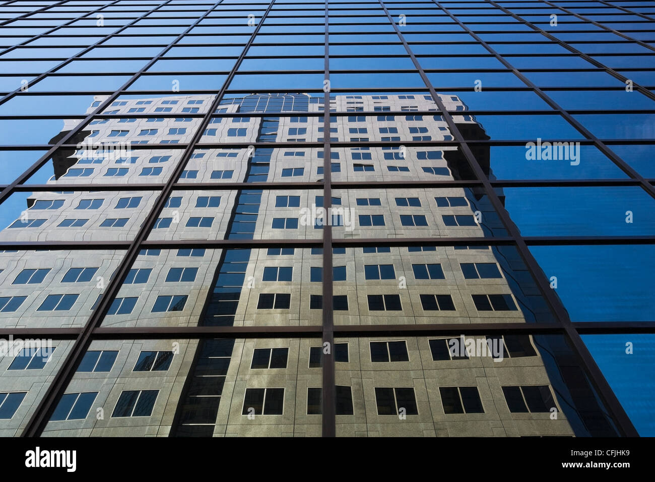 Building reflected in glass skyscraper Stock Photo - Alamy