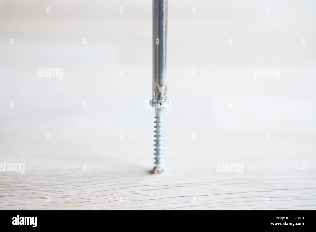 Screwdriver and screw Stock Photo - Alamy